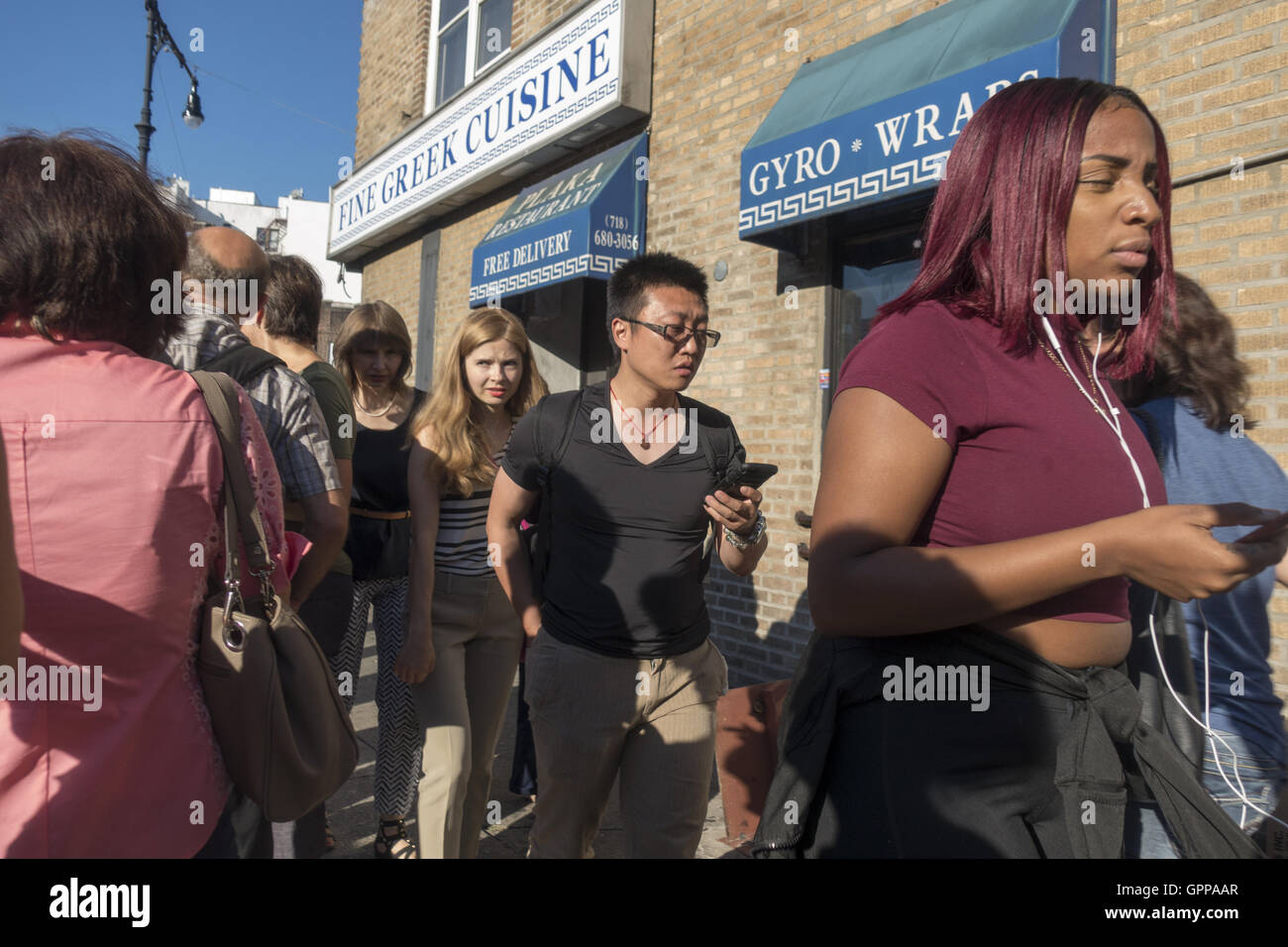 Crowded corner near the subway station and bus stop on 4th Avenue in ...