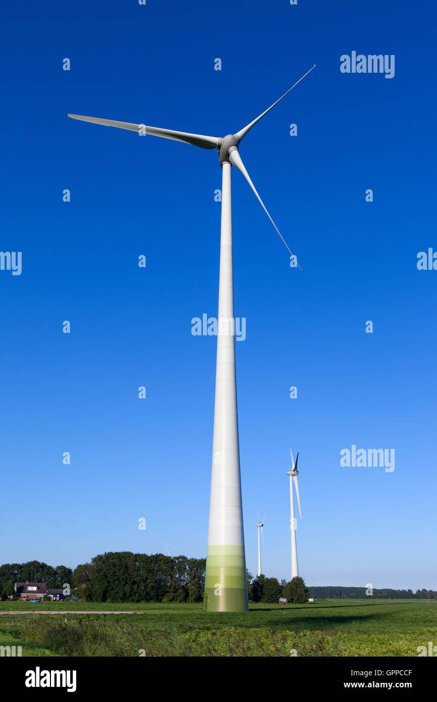 Wind turbine spinning with in a green countryside environment Stock ...