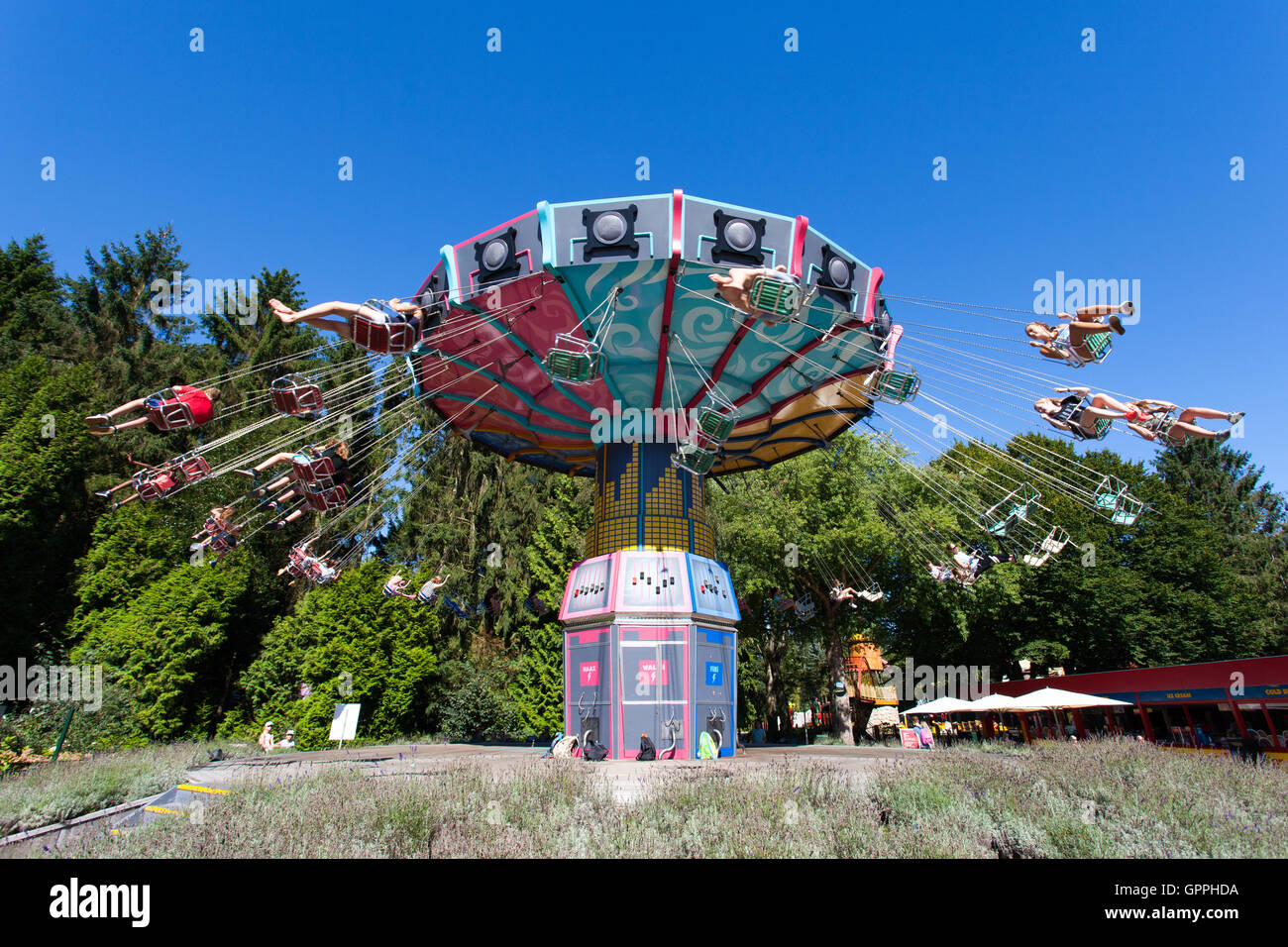 High speed carousel with park visitors during a ride at Walibi theme ...