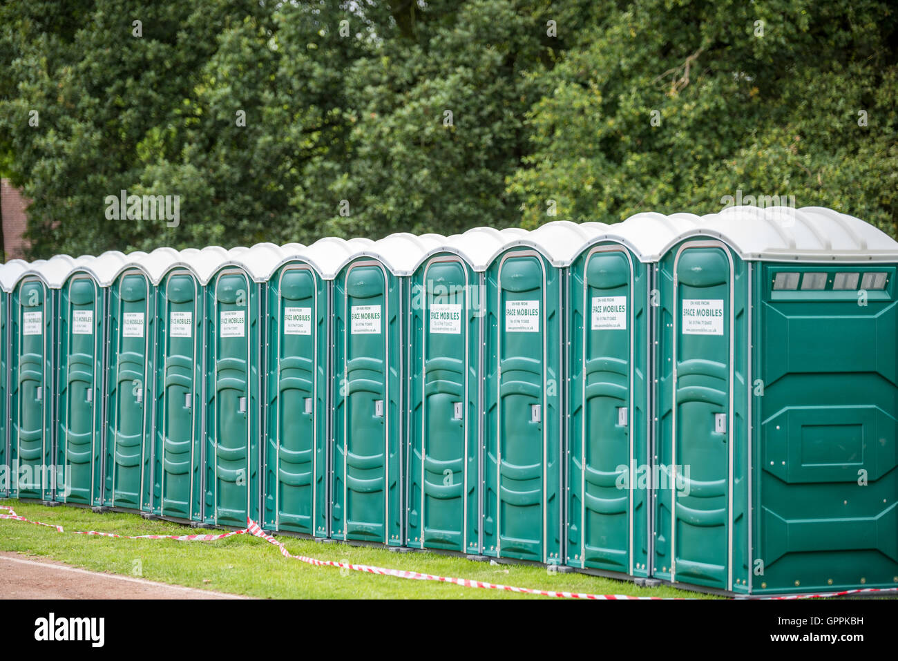 A row of green loos Stock Photo - Alamy