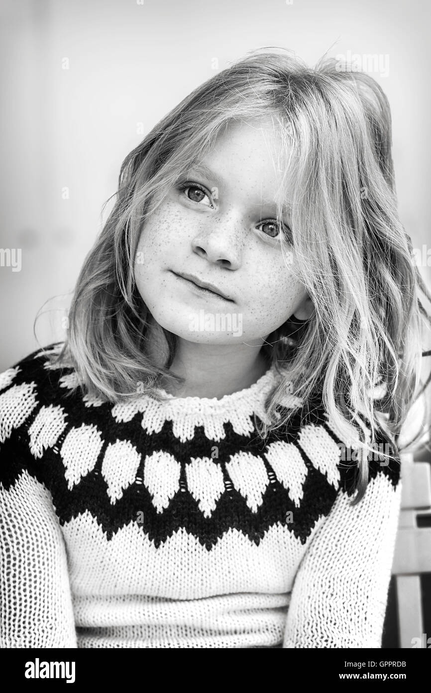 Young girl with a messy hair and wearing a sweater Stock Photo - Alamy