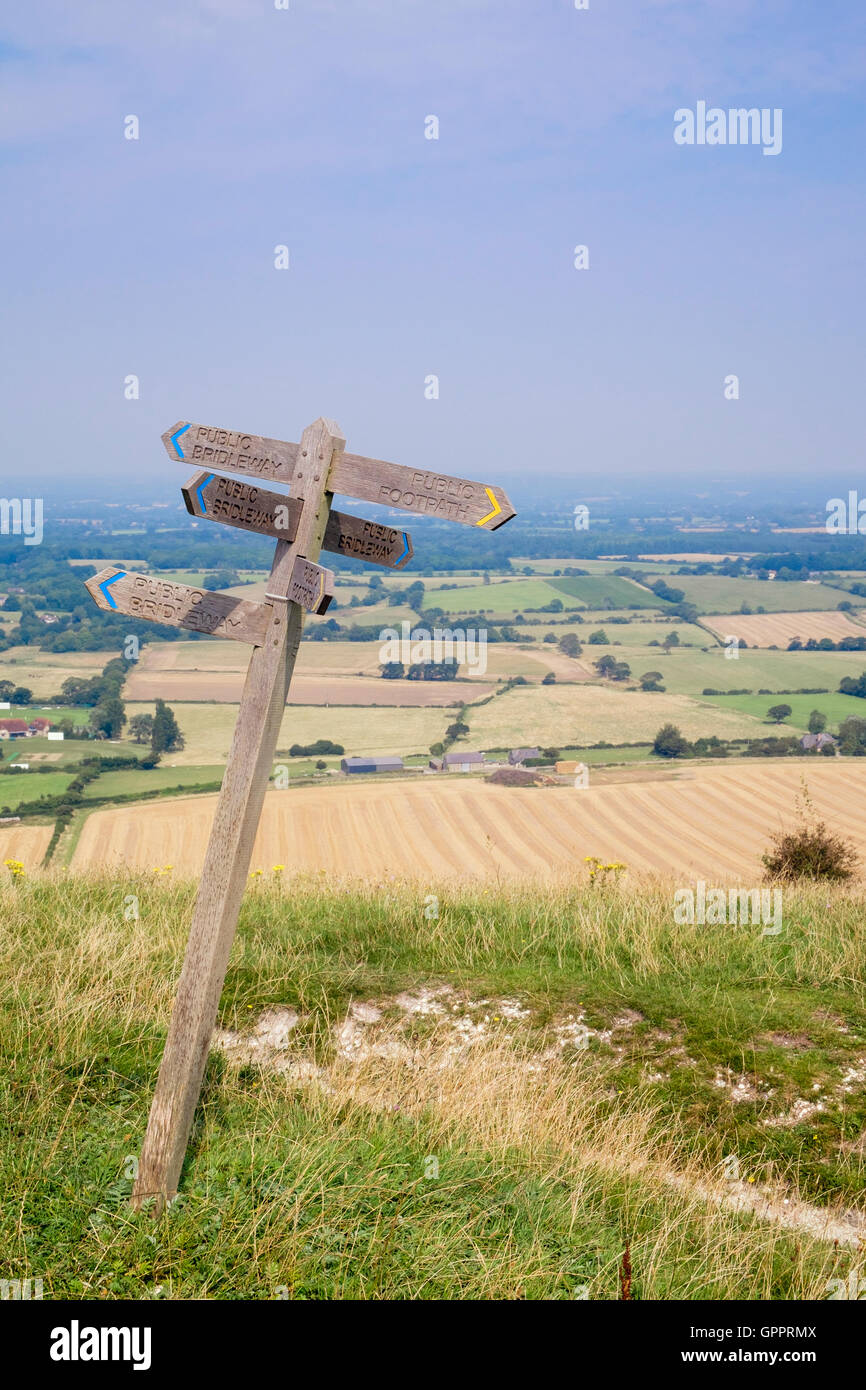 Wonky footpath and bridleway signpost on hills above Fulking escarpment ...