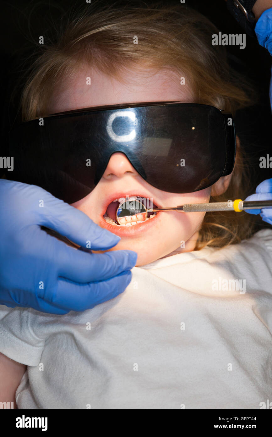 Baby toddler girl 2 yr two year old child during her first 2nd check up ...