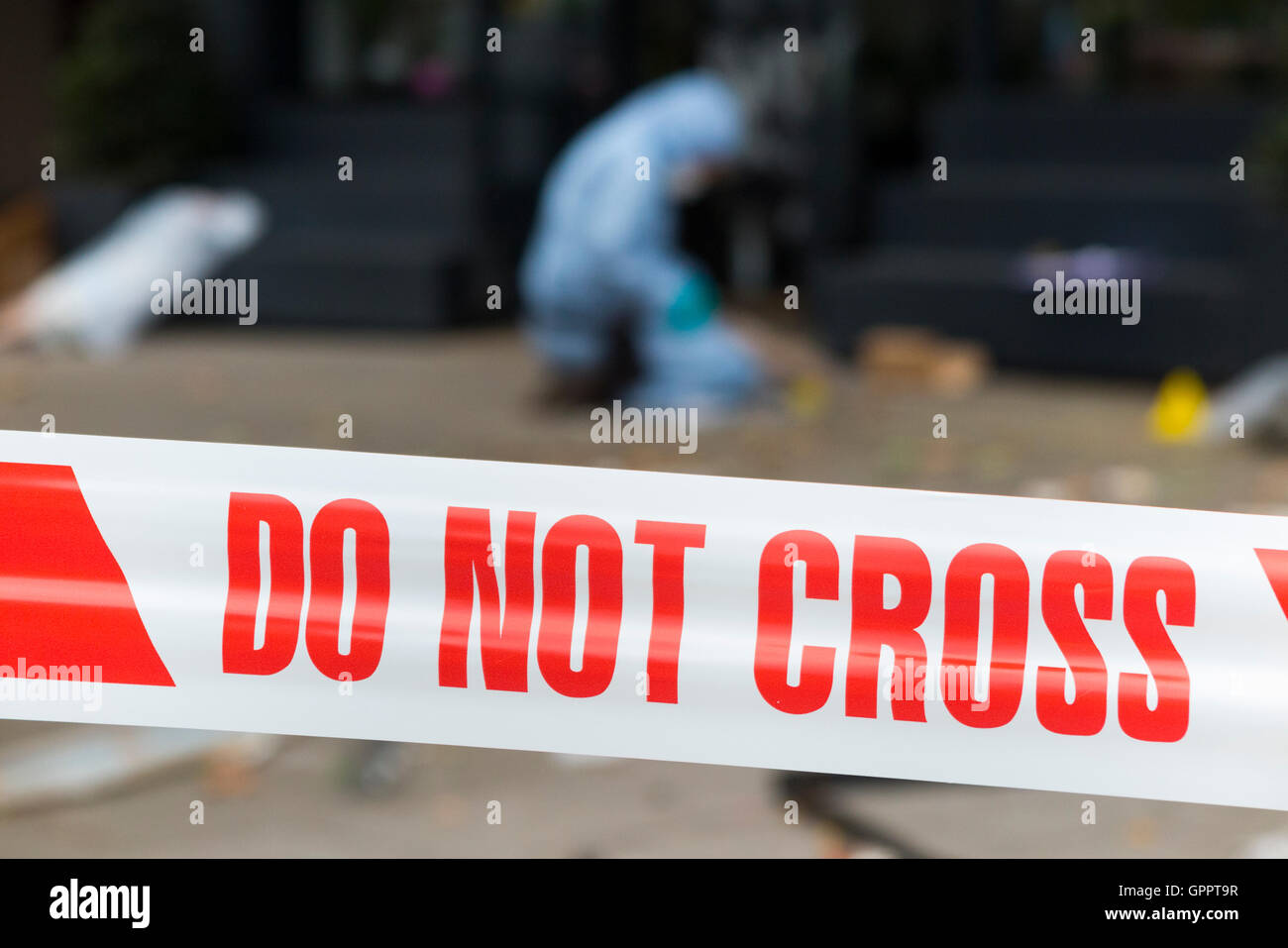 Police do not cross tape barrier & scene of crime officer / crimes ...