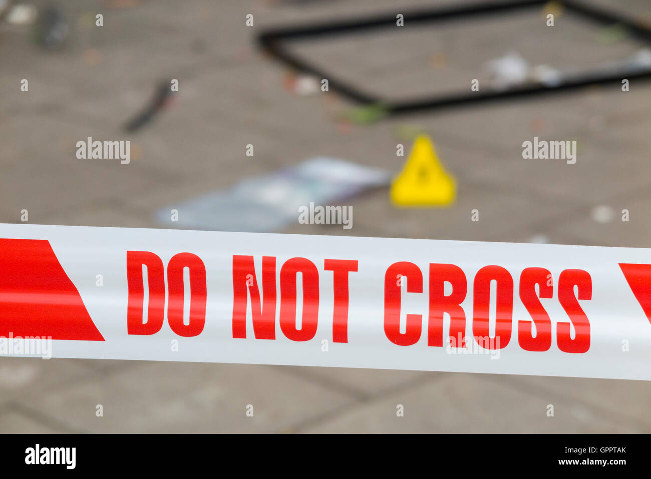 Police inner cordon tape barrier & evidence identification number ...