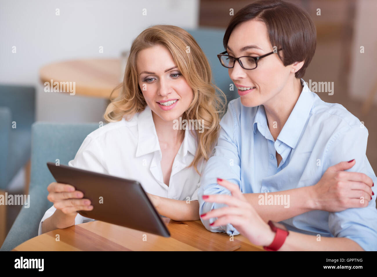 Attractive colleagues working together Stock Photo - Alamy