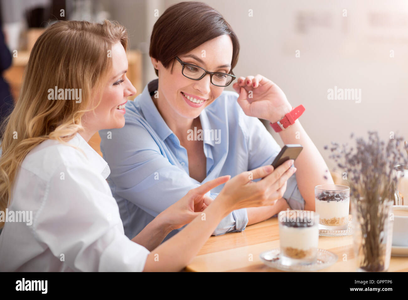Two attractive women relaxing together Stock Photo - Alamy