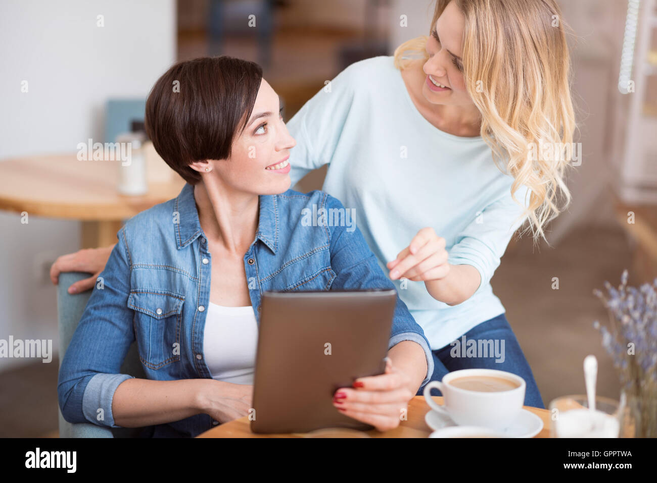 Nice women working together Stock Photo - Alamy