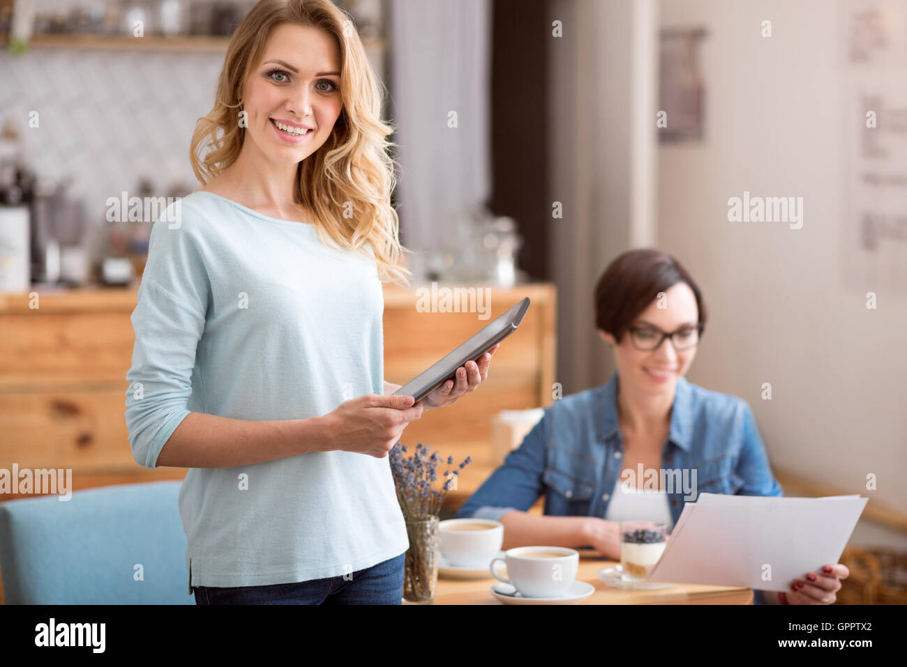 Cute young women working Stock Photo - Alamy