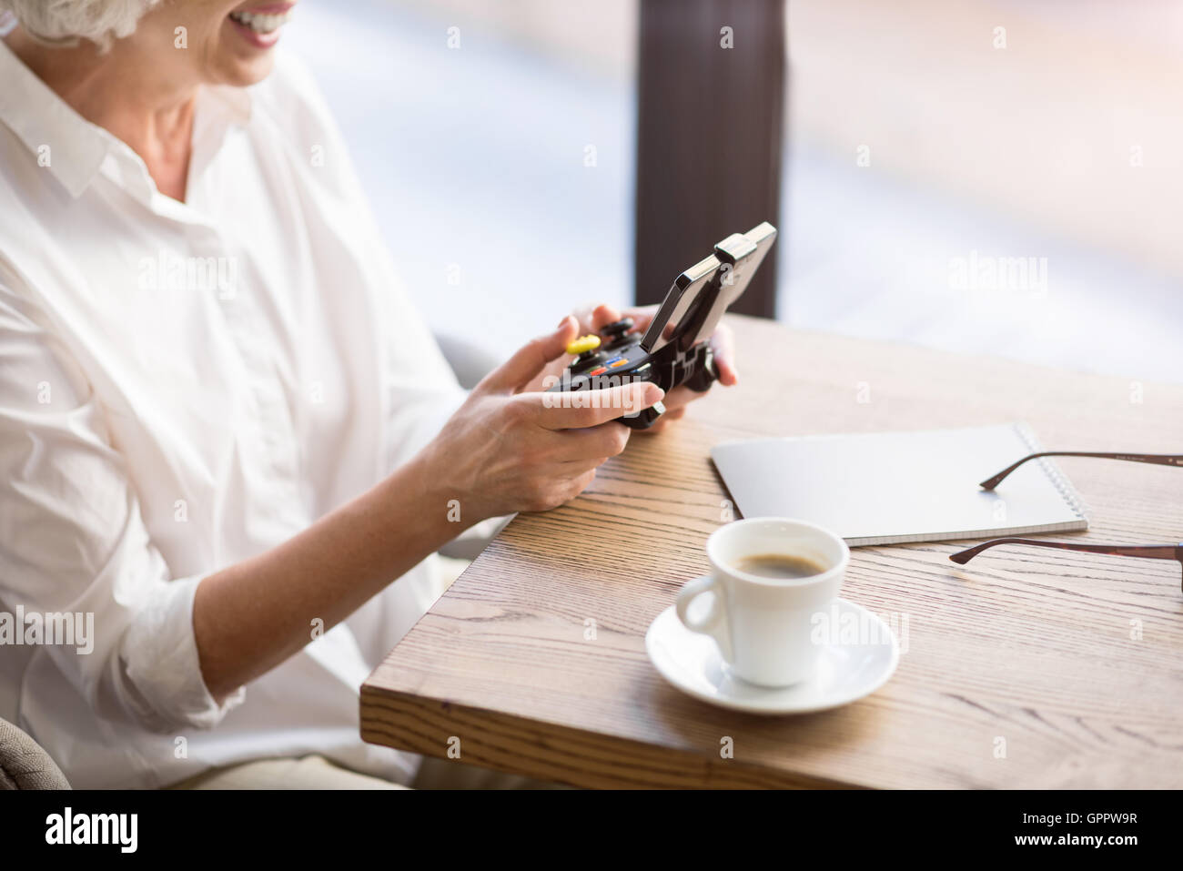 Positive woman resting at the table Stock Photo - Alamy