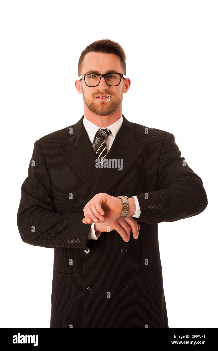 Successful businessman in formal suit checking time on wrist watch ...