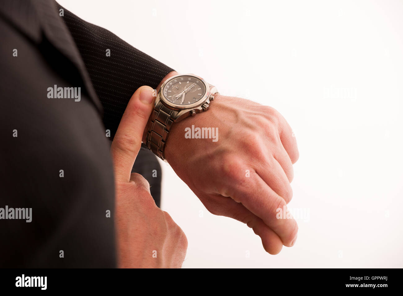 Confident young businessman checking hi-res stock photography and ...