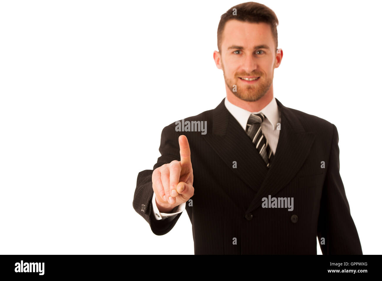 Happy young businessman in suit and tie presenting, promoting ...