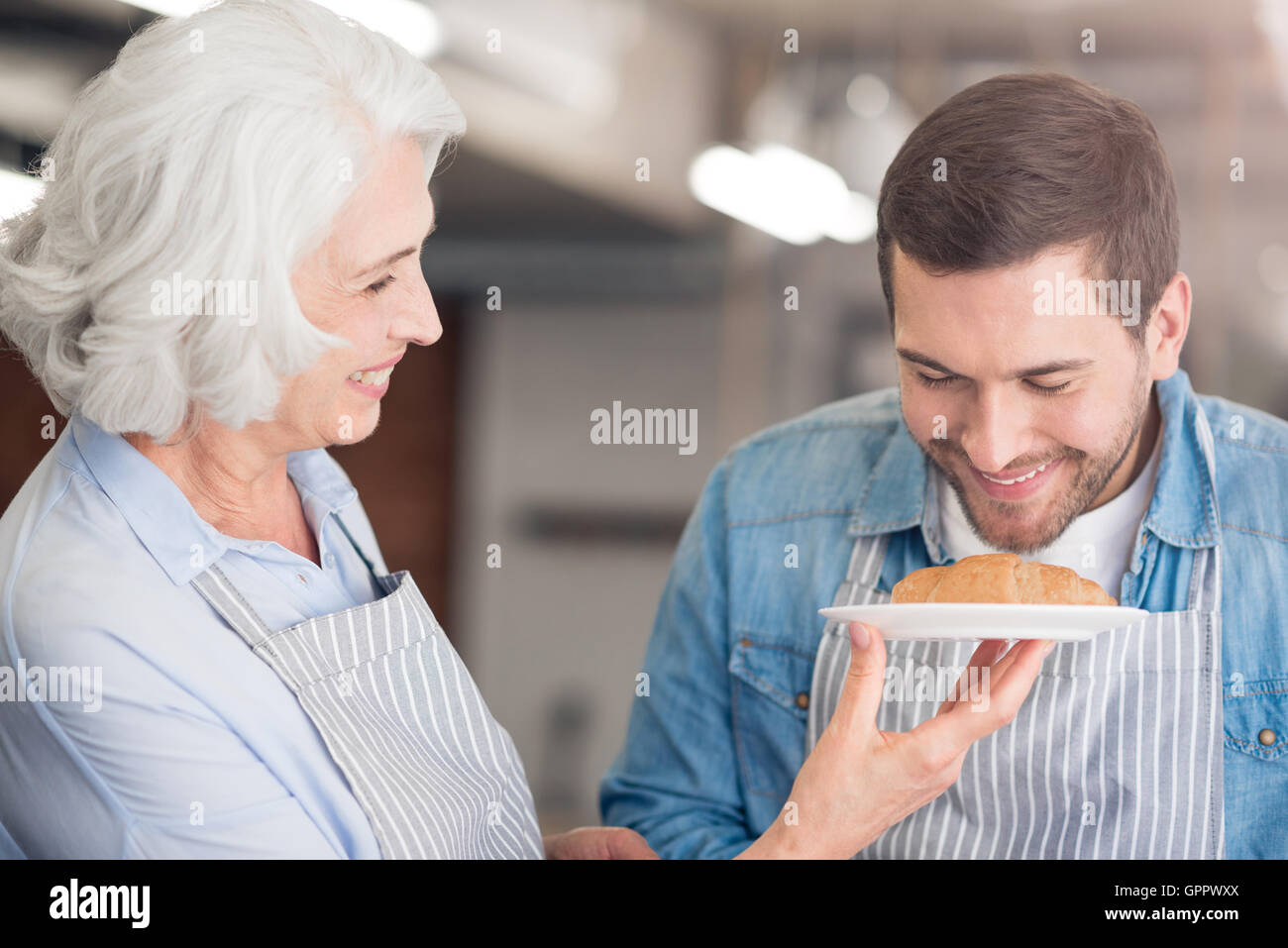 Positive bakers standing in the bakery Stock Photo - Alamy