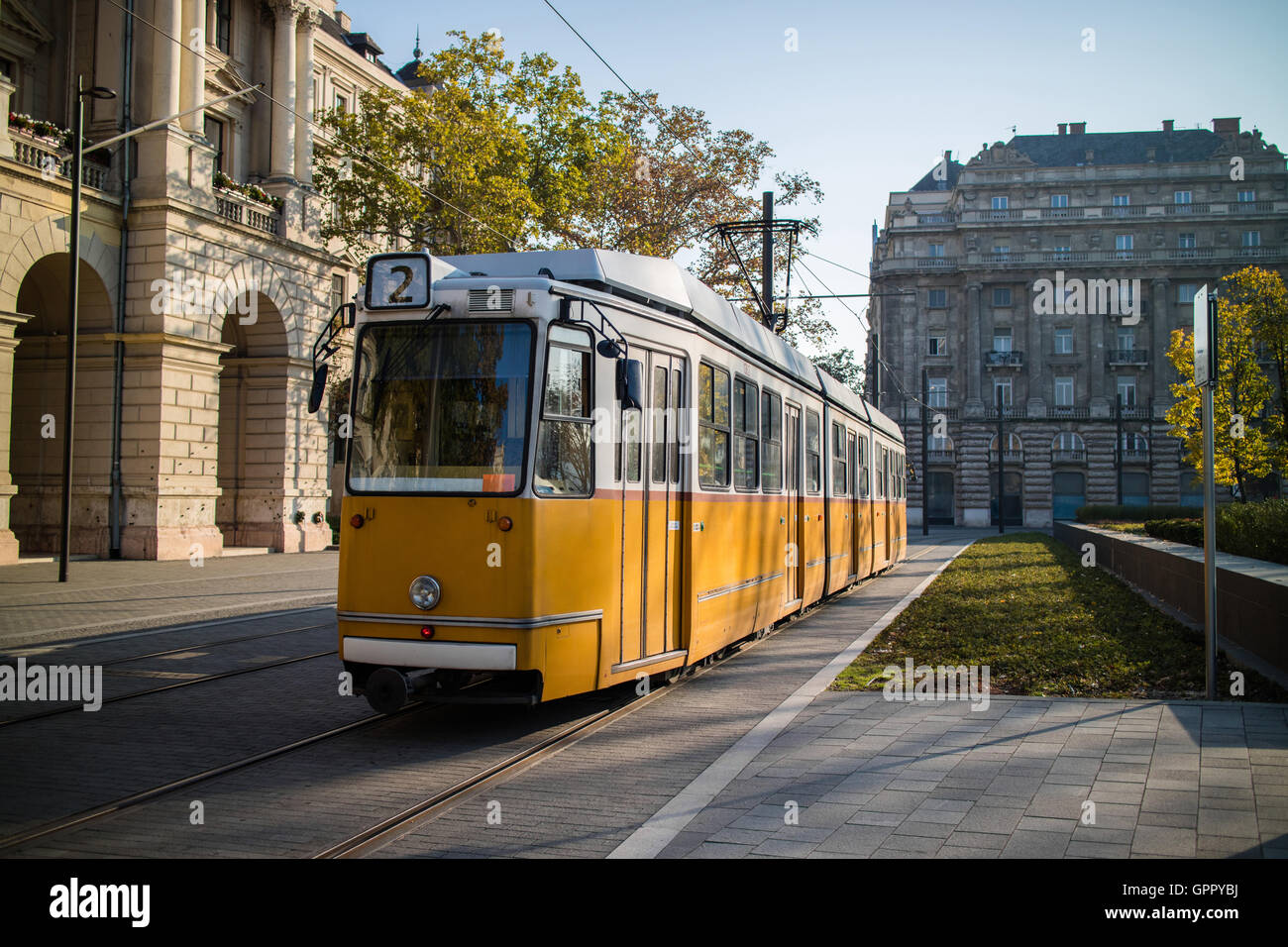 Famous yellow tram of Budapest at a square Stock Photo - Alamy