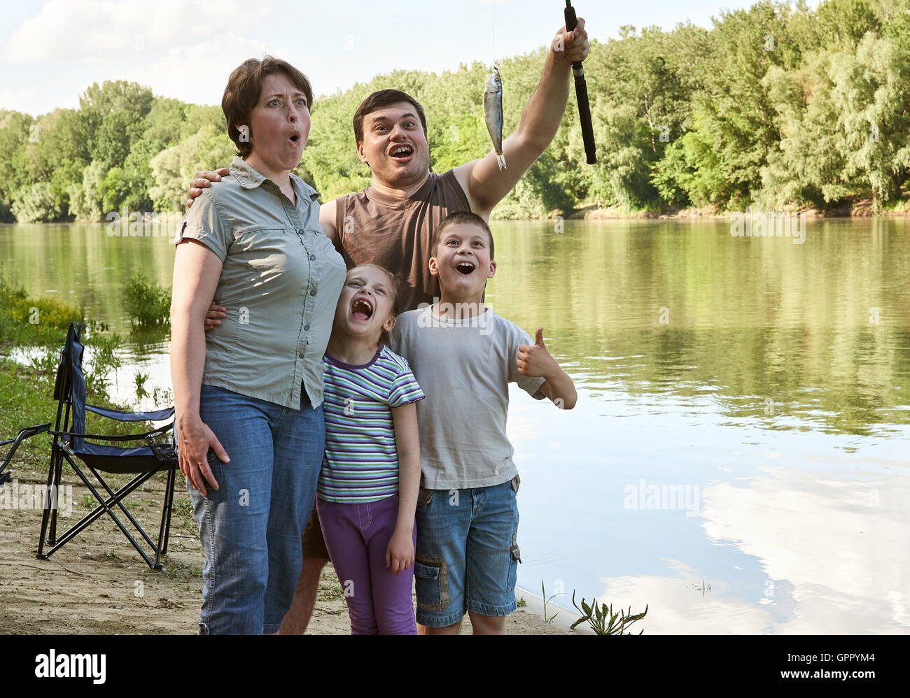 family with emotion catch fish, people camping and fishing, leisure in ...