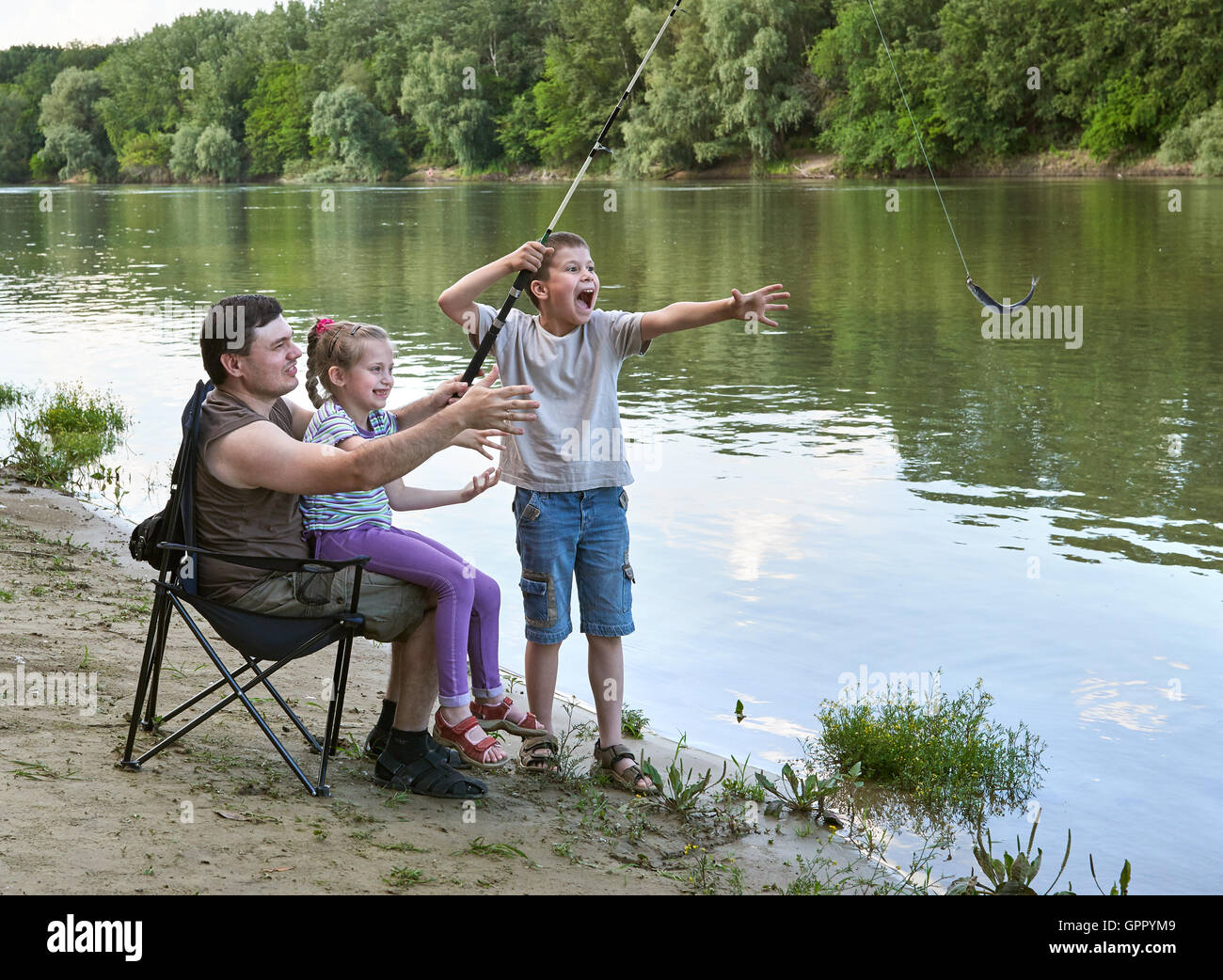people camping and fishing, family active in nature, fish caught on ...
