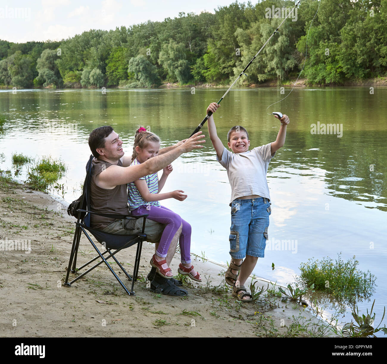 people camping and fishing, family active in nature, fish caught on ...
