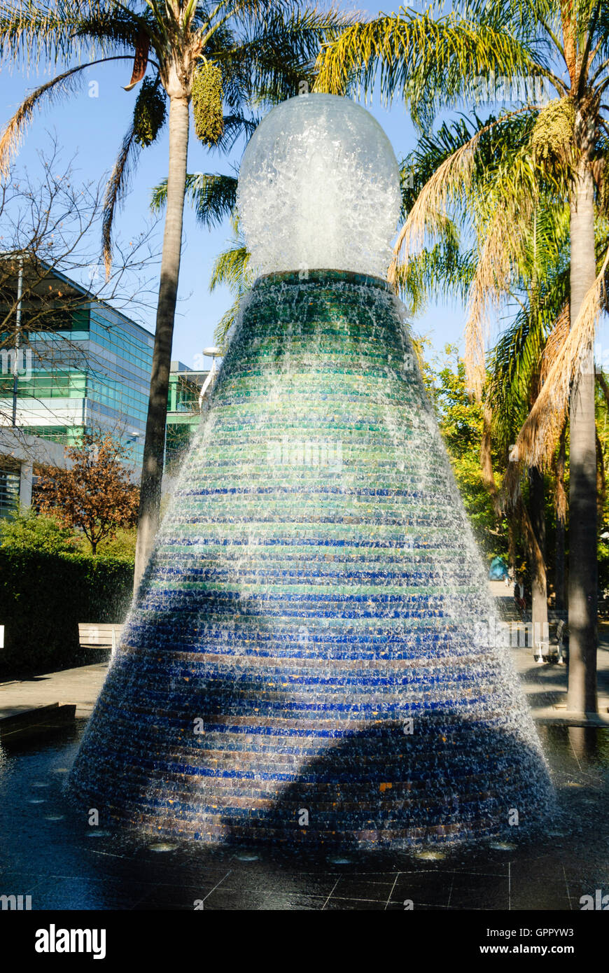 Volcano shaped fountain erupting Stock Photo - Alamy