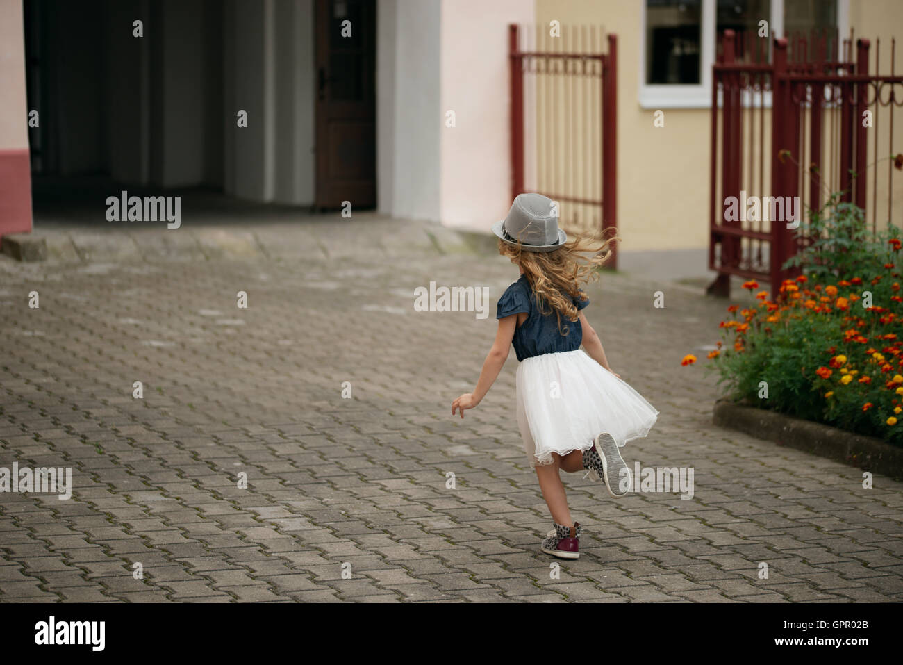 young happy girl running away Stock Photo - Alamy