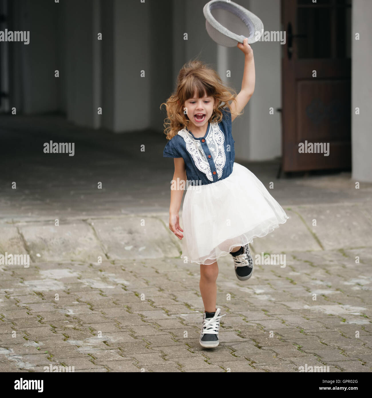 young happy girl running away Stock Photo - Alamy