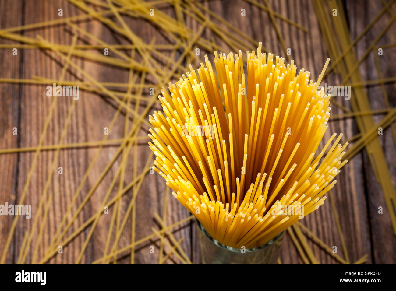 italian spaghetti on wooden background Stock Photo - Alamy