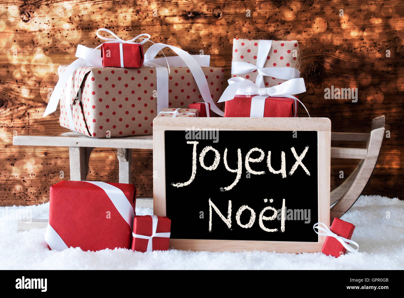 Sleigh With Gifts, Snow, Bokeh, Joyeux Noel Means Merry Christmas Stock ...