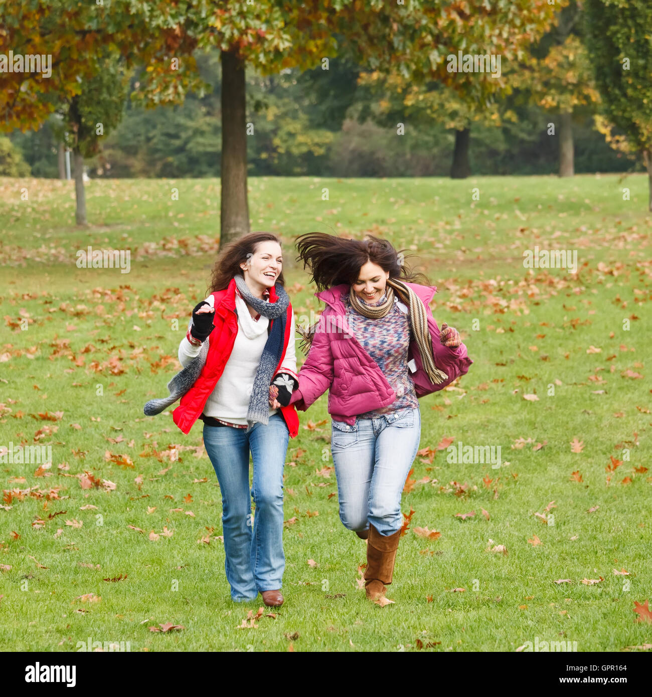 Two pretty girls in the park Stock Photo - Alamy