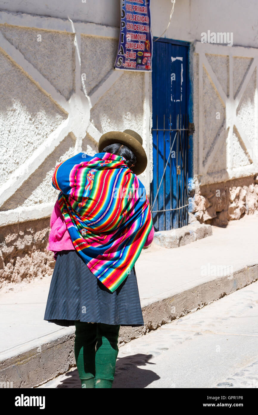 Maras Peru -May 18 : Native Quechua woman with beautiful colors walking ...