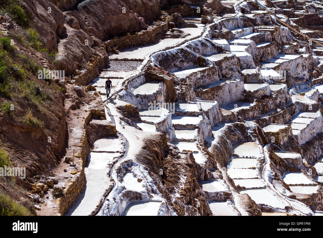 Maras Peru -May 18 : Tourists walking exploring the salt ponds in Maras ...