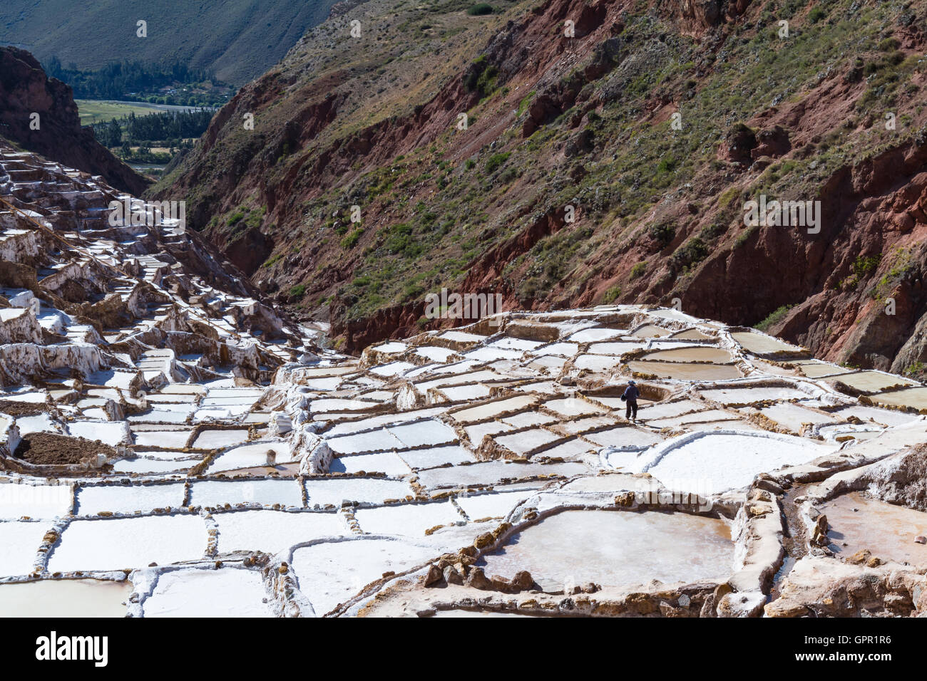 Maras Peru -May 18 : Tourists walking exploring the salt ponds in Maras ...