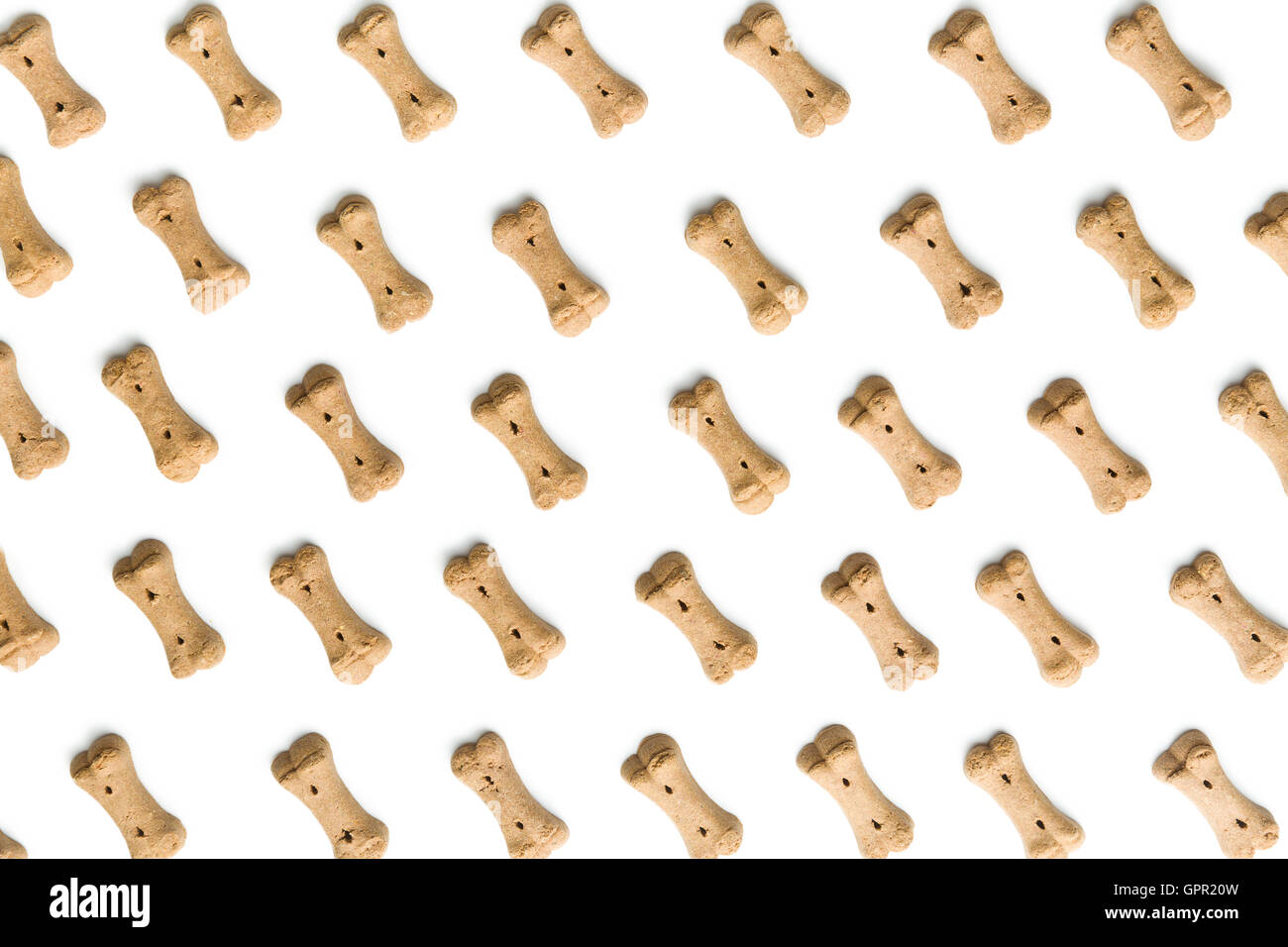 Dog food shaped like bones isolated on white background Stock Photo - Alamy