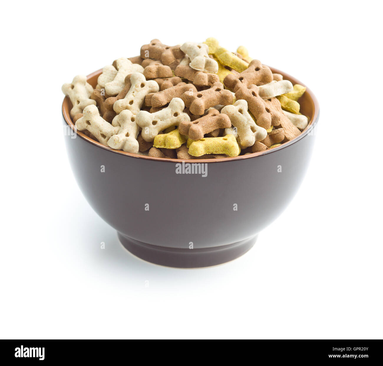 Dog food shaped like bones in bowl isolated on white background Stock ...