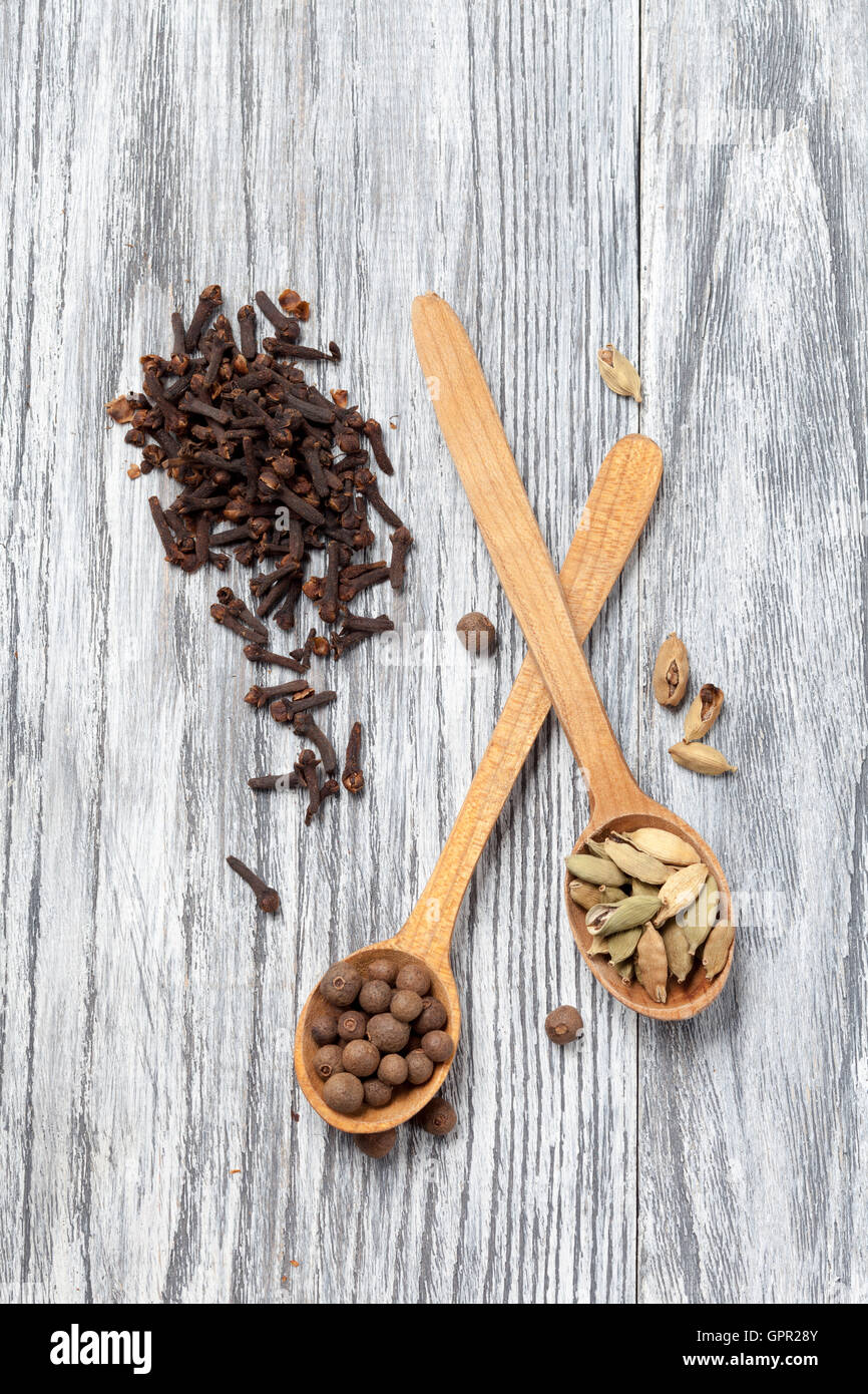 Nutmeg, clove and allspice in old spoon on wood Stock Photo - Alamy