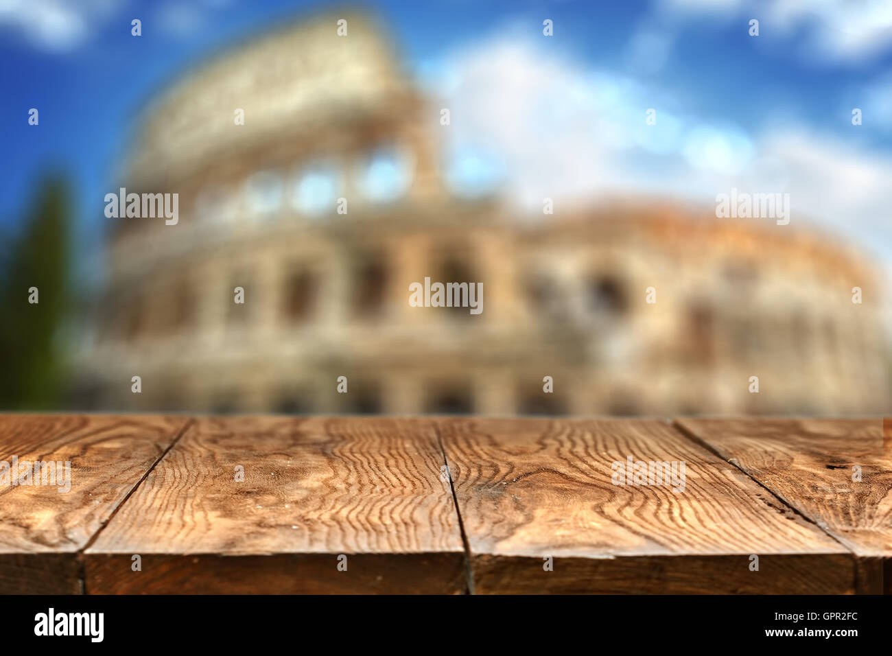 Empty wooden table with Colosseum on background Stock Photo - Alamy
