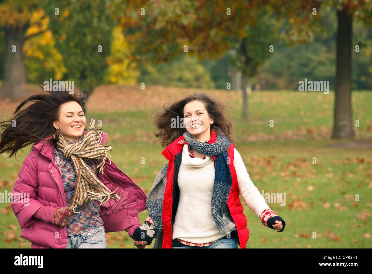 Two pretty girls in the park Stock Photo - Alamy