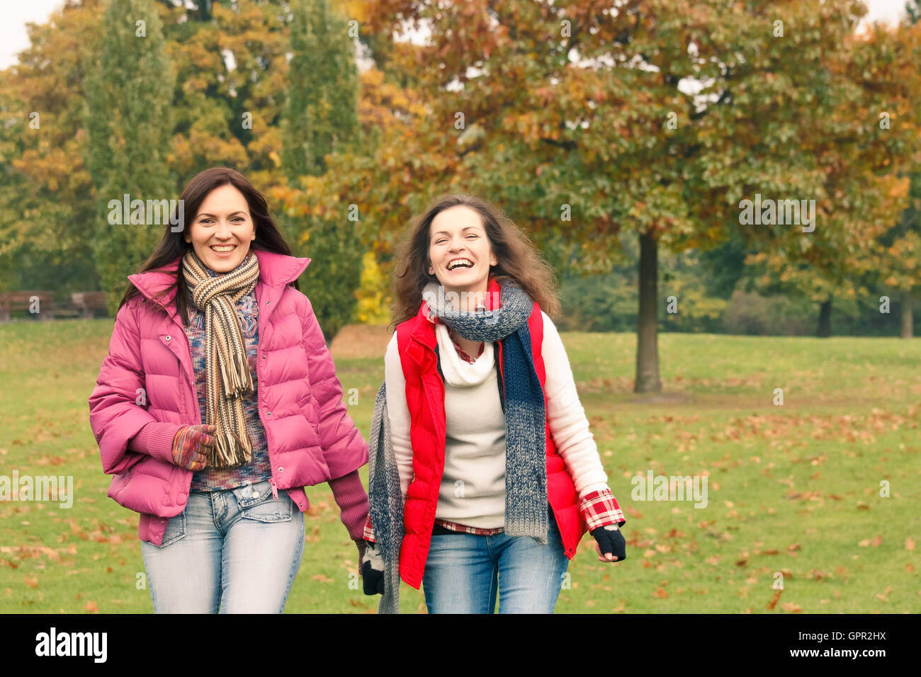 Two pretty girls in the park Stock Photo - Alamy