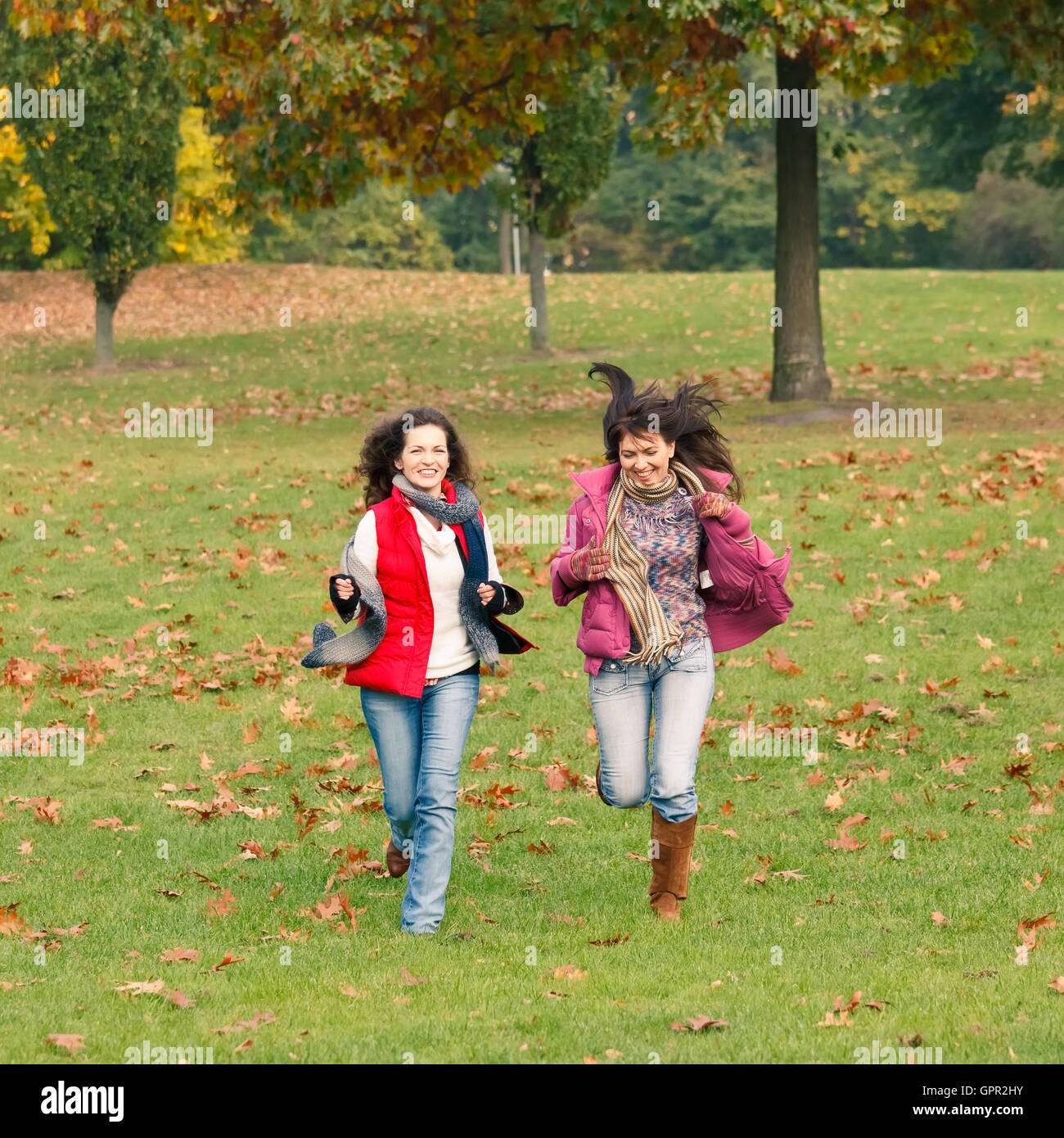 Two pretty girls in the park Stock Photo - Alamy