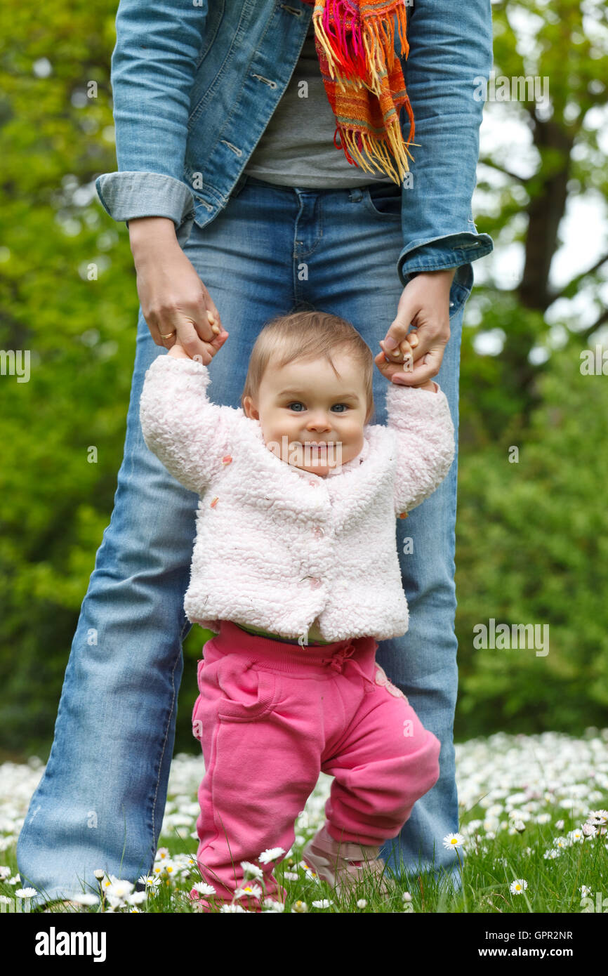 Baby's first steps Stock Photo - Alamy