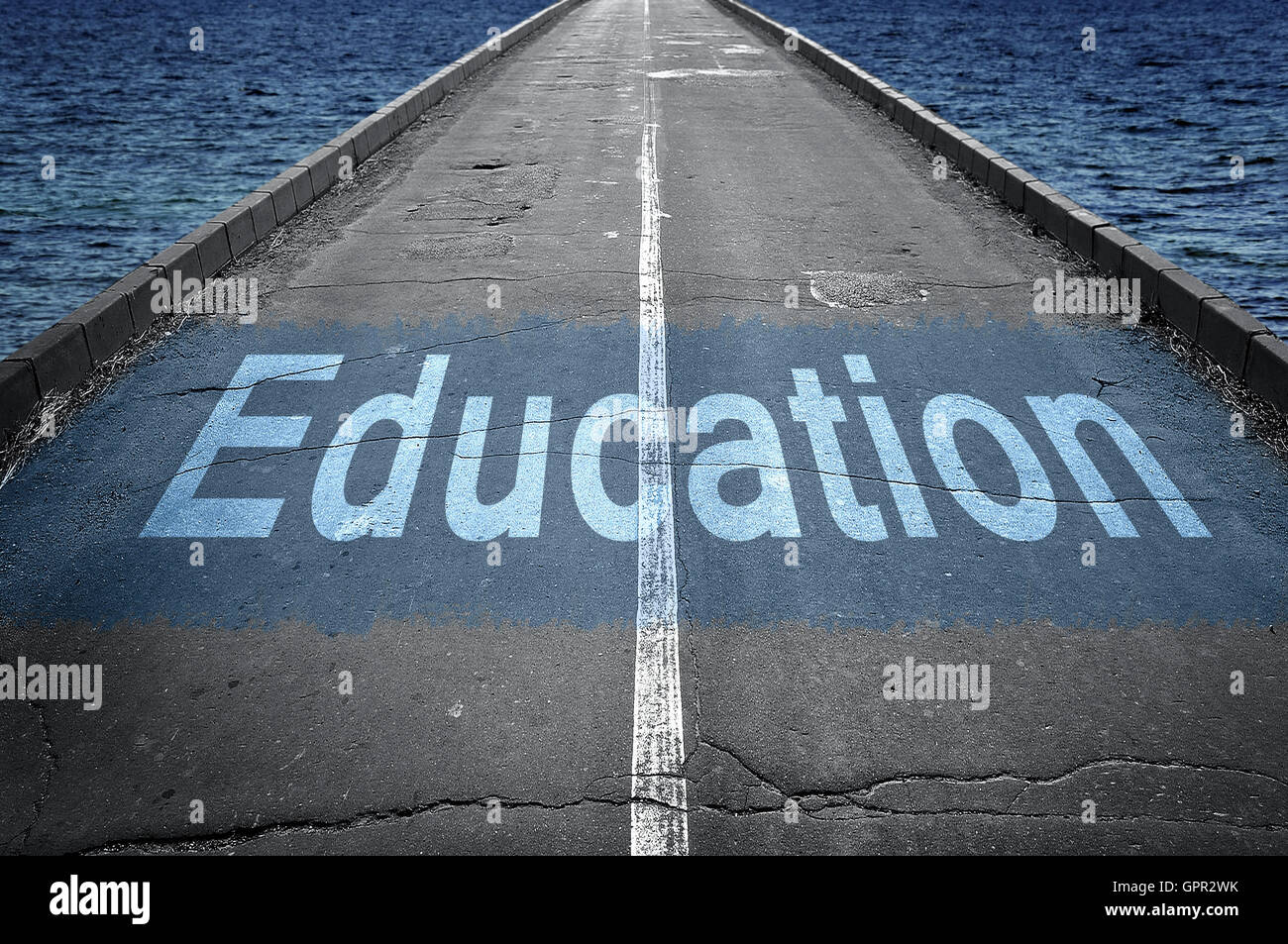 Education message on empty road Stock Photo - Alamy
