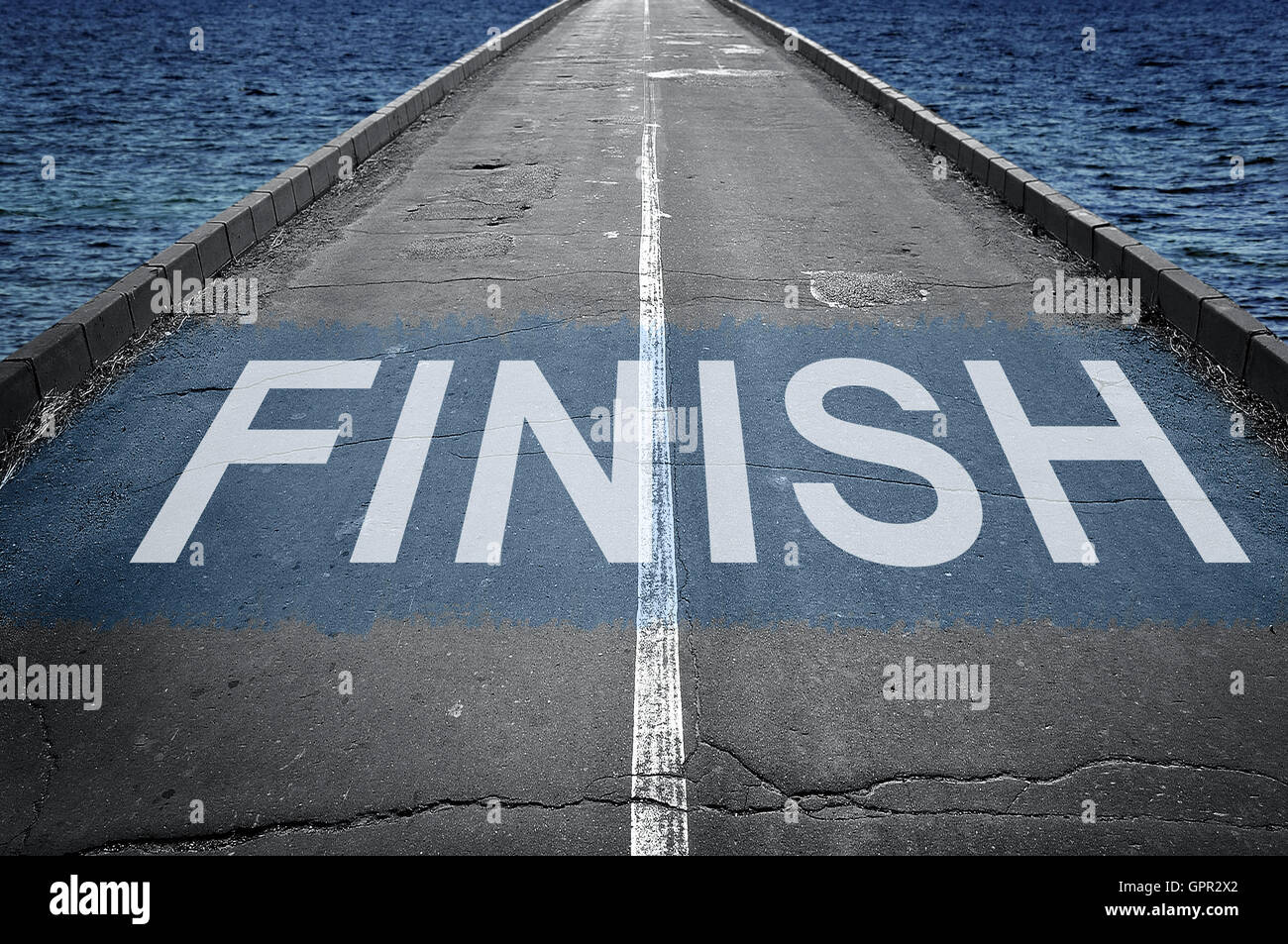 Finish line on empty road Stock Photo - Alamy