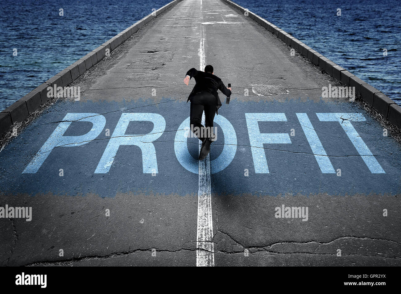 Profit message on road and business man Stock Photo - Alamy