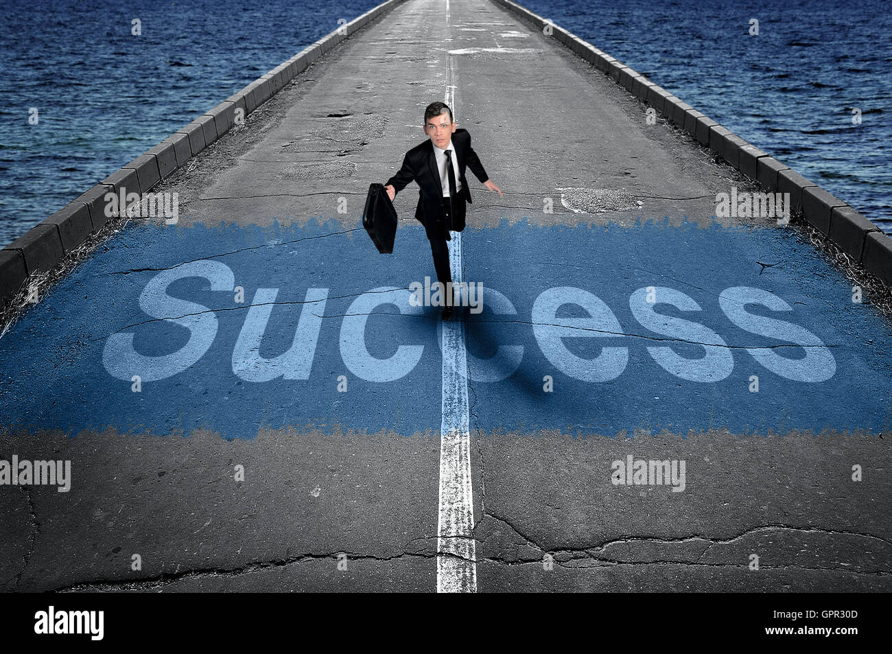 Success message on road and business man Stock Photo - Alamy