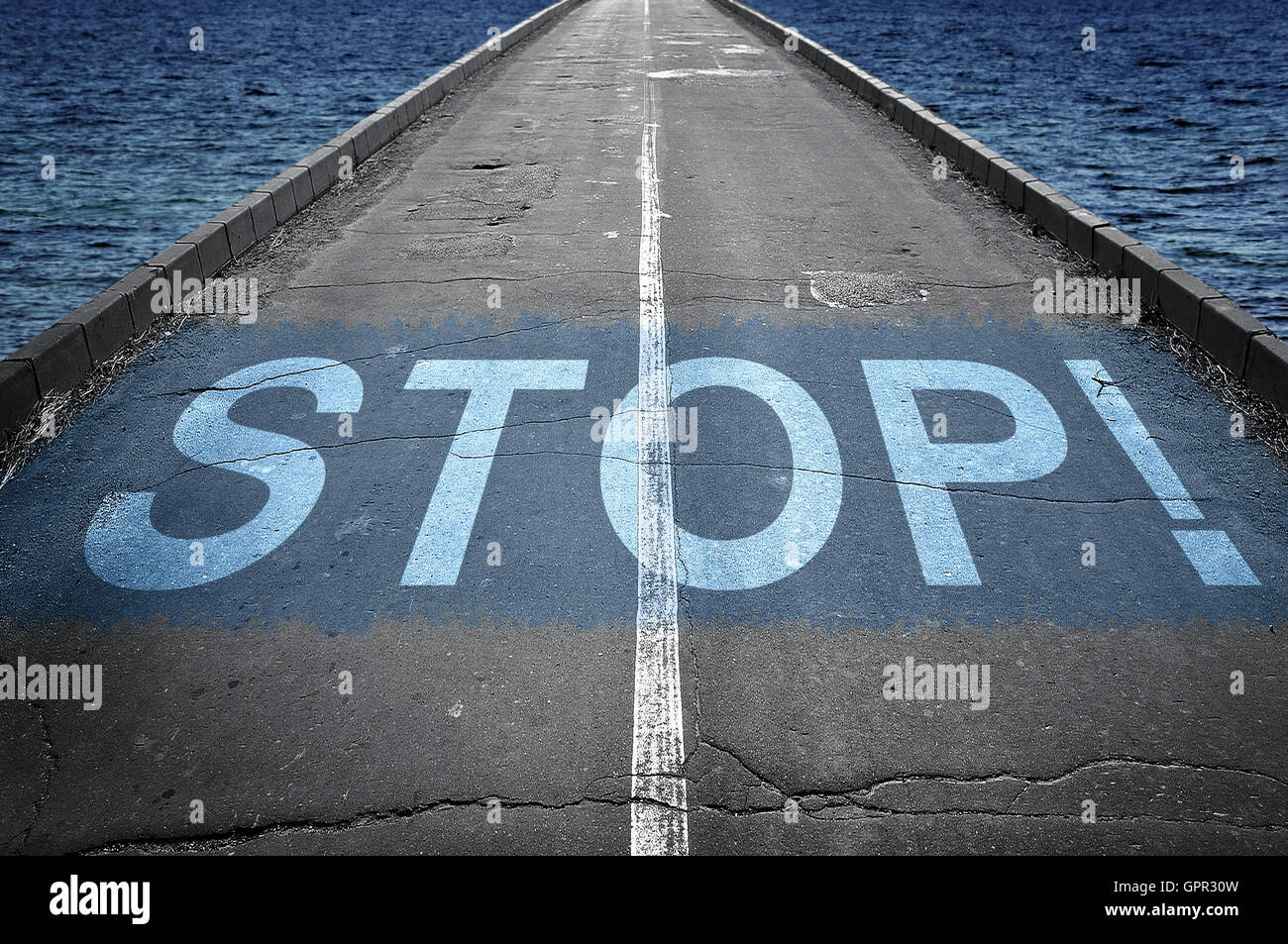 Stop message on empty road Stock Photo - Alamy