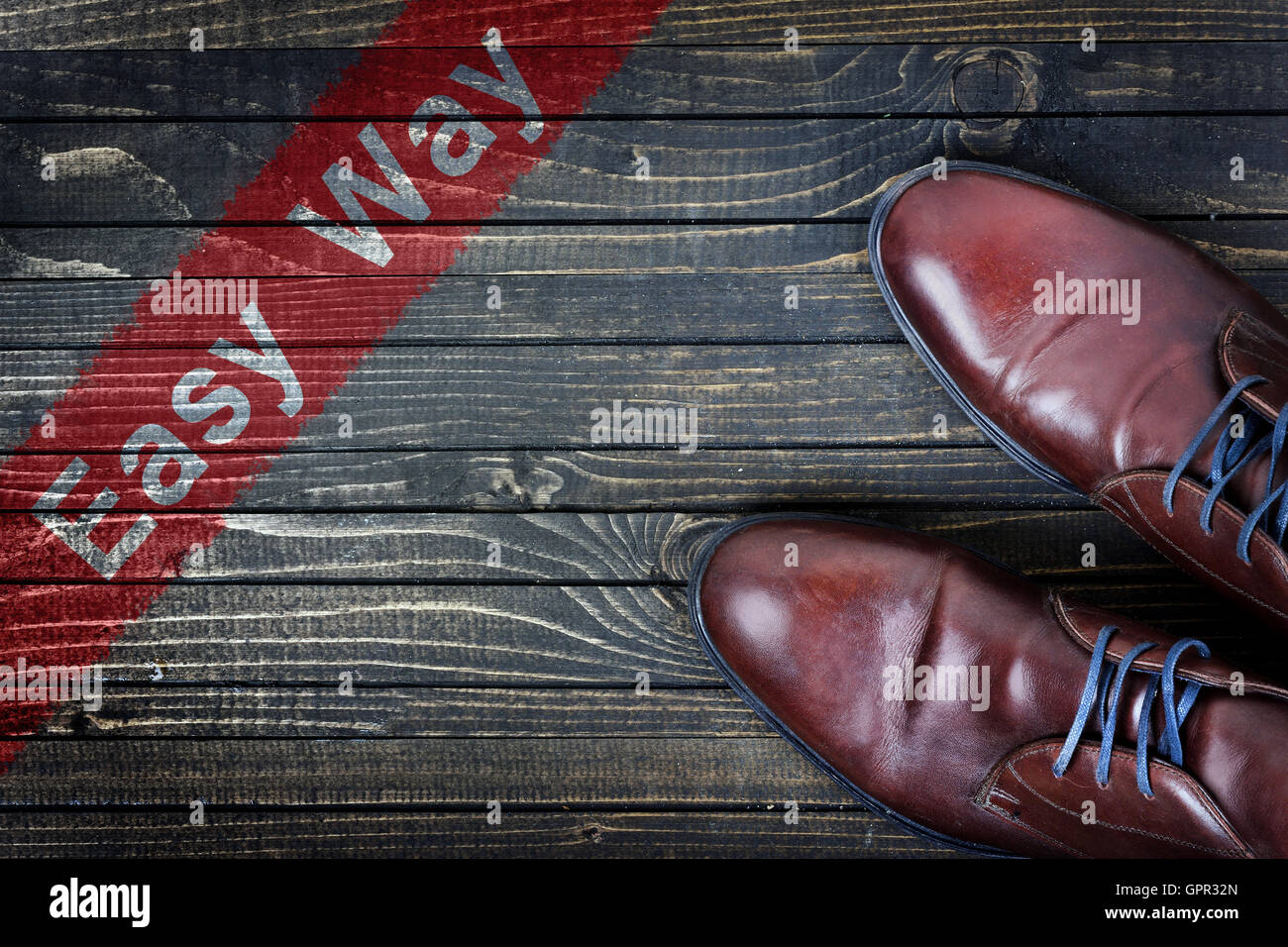 Easy way message and business shoes on wooden floor Stock Photo - Alamy