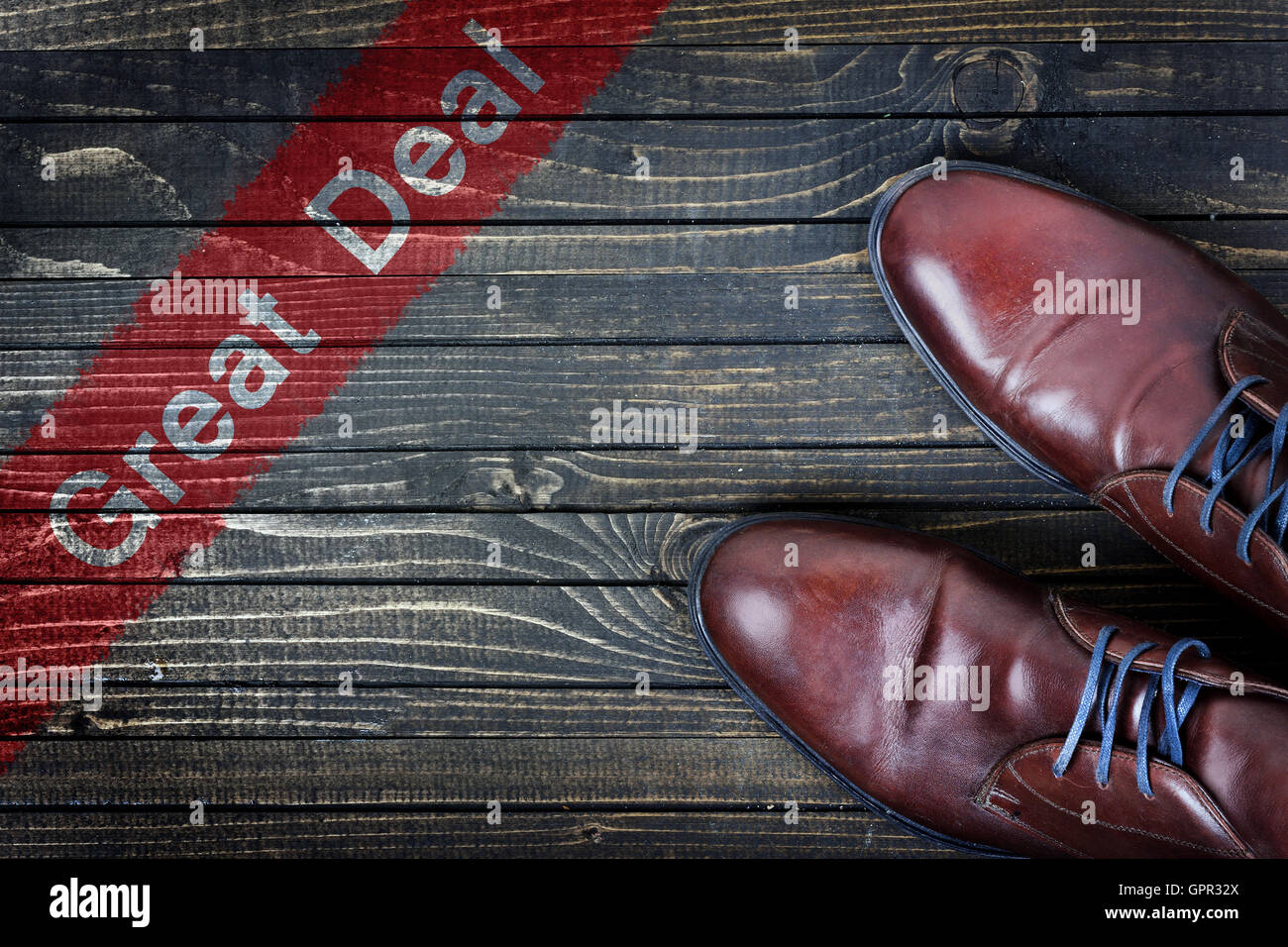 Great Deal message and business shoes on wooden floor Stock Photo - Alamy