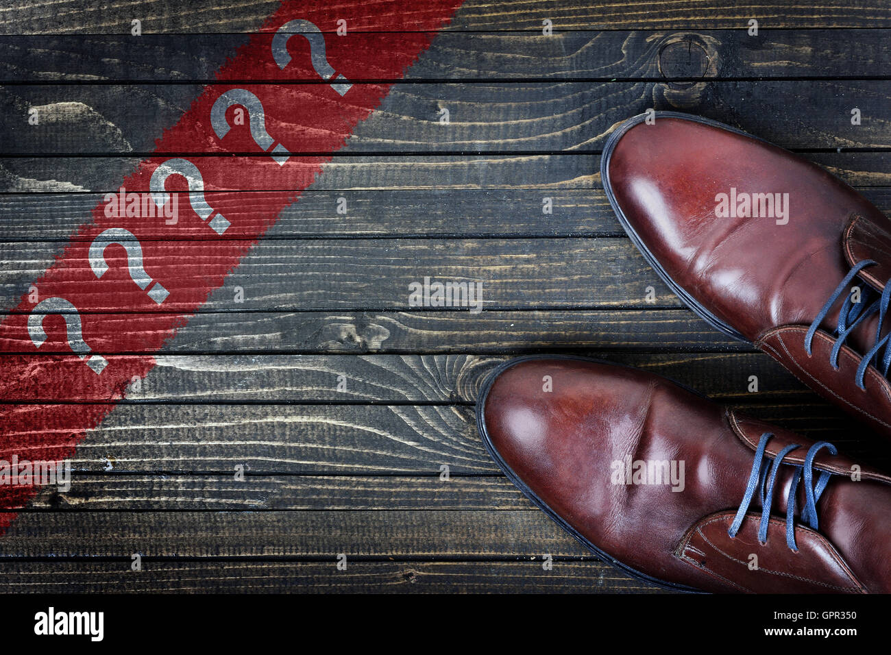 Question marks message and business shoes on wooden floor Stock Photo ...