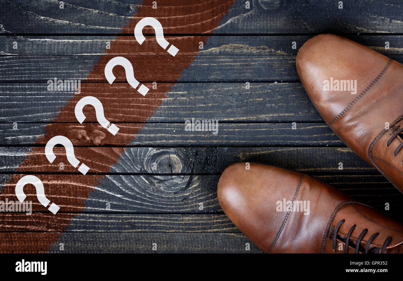 Question marks message and business shoes on wooden floor Stock Photo ...