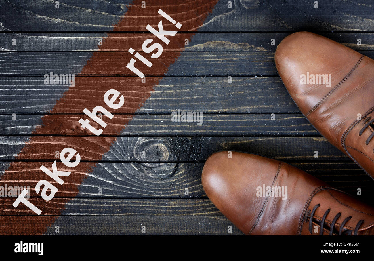 Take the risk message and business shoes on wooden floor Stock Photo ...