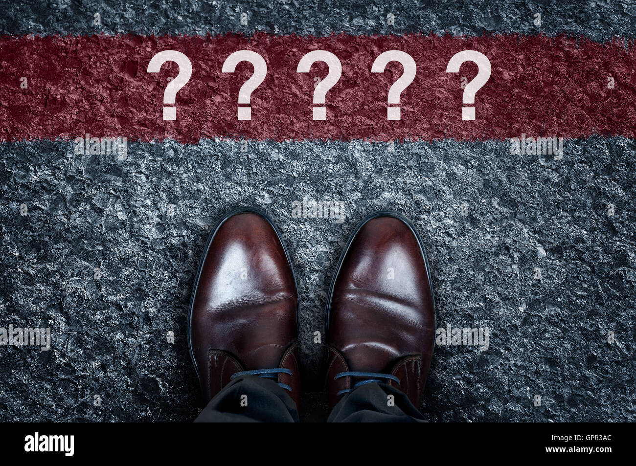 Question marks message on asphalt and business shoes Stock Photo - Alamy